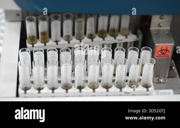Automated urine analyzer processes multiple test tubes with samples in ...