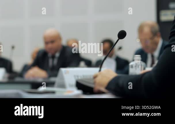 Close up of conference microphone on table during corporate business ...