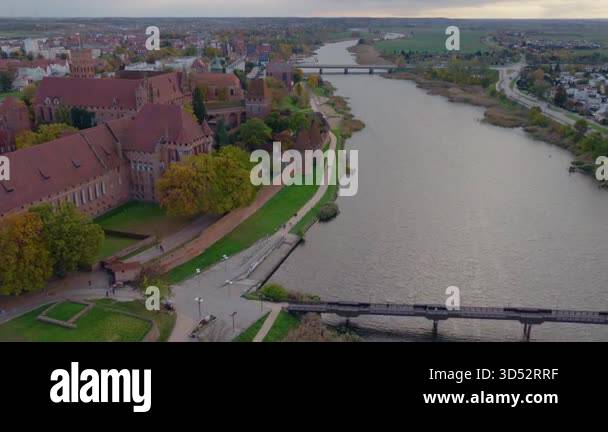 Aerial view shows Malbork Castle in Malbork, Poland. Camera glides ...