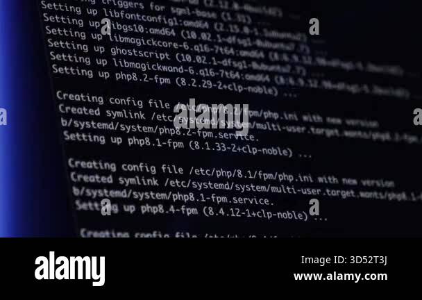 Close-up view of a dark computer screen displaying numerous white lines of PHP programming code ...