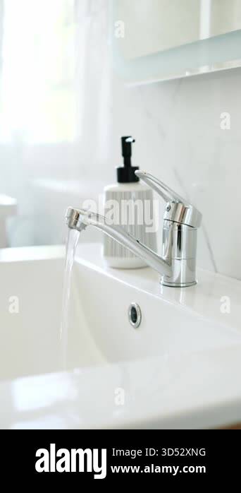 Womans Hand Turning Off Water In Bathroom Faucet Vertical Video Stock ...