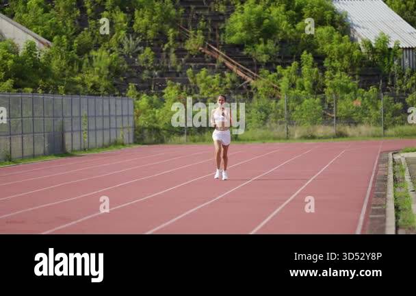 Super slow motion, morning motivation jog, sporty woman runs at a ...