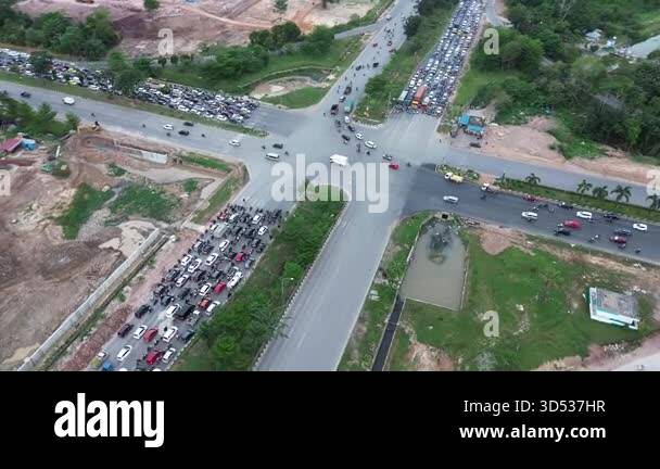 Overhead Perspective of a Bustling City Junction with Peak Hour Vehicle ...