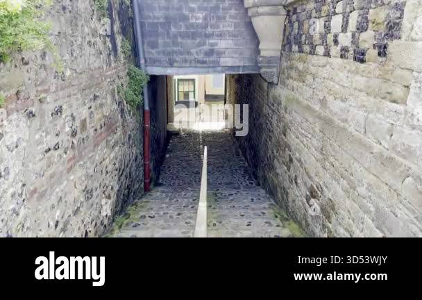 Narrow cobbled passage beneath Saint-Martin Church in Saint-Valery-sur ...