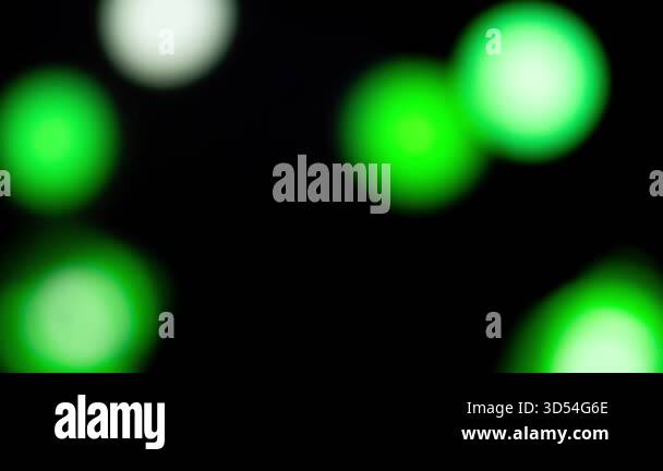 Soft green illumination with cinematic blur and grainy dust, loop ...