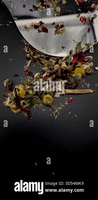 Bright yellow chamomile flowers, fresh green melissa leaves, and deep ...