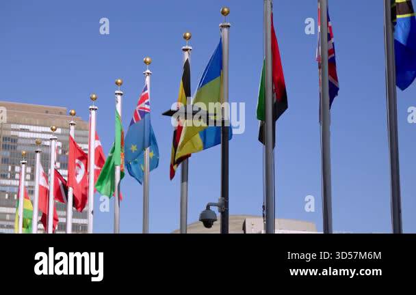 New York 10.28.2025. Row of colorful international flags waving in ...