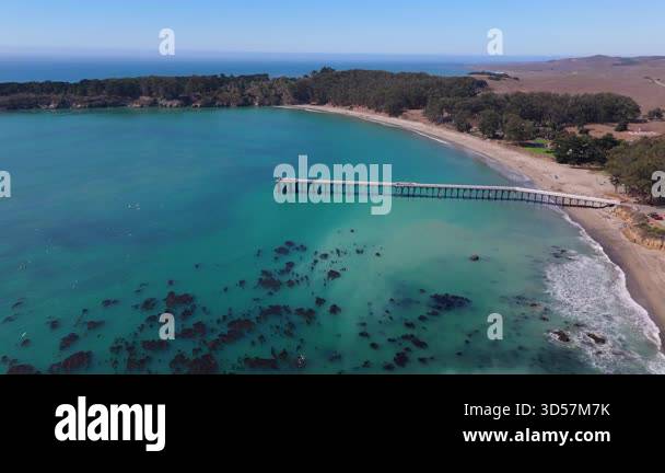 Aerial drone view of Cayucos Pier near Morro Bay California with clear ...