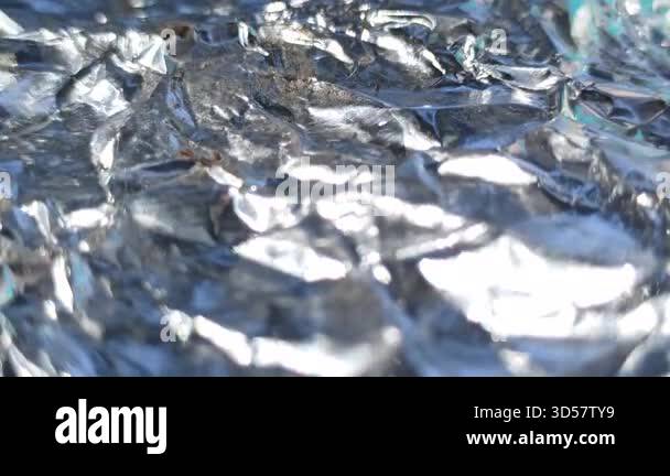 A beautiful pattern formed on aluminum foil surface, reflecting light ...