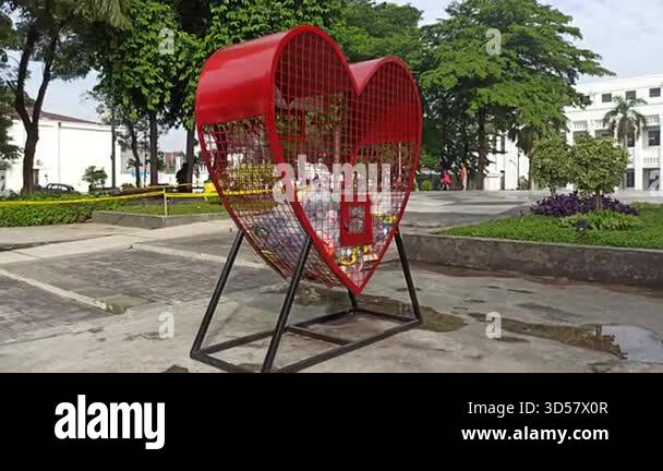 A heart-shaped trash bin with a creative design, symbolizing love for ...