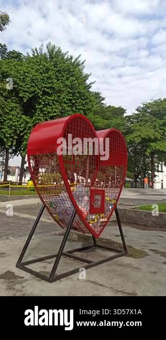 A heart-shaped trash bin with a creative design, symbolizing love for ...