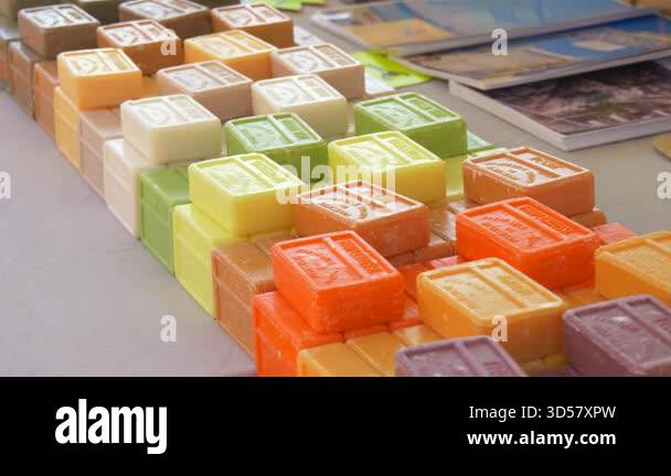 Display of handmade natural soap bars in various bright colors at a ...