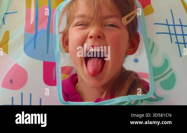 A sweet little girl expresses dissatisfaction and screams in aggression ...