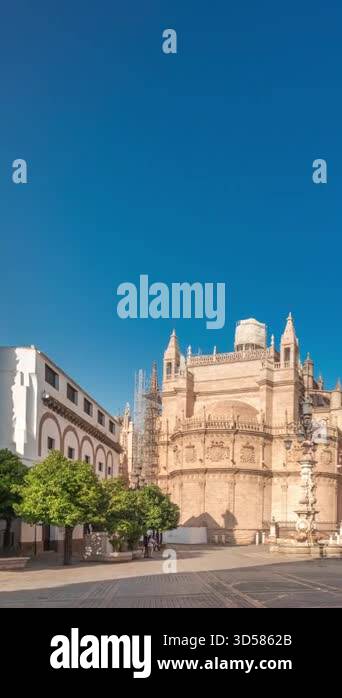 Panorama showing the Seville Cathedral and Giralda Tower timelapse ...