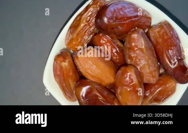 Close-up of dried dates in a white bowl. Healthy, natural food Stock ...