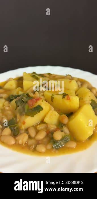 Stew with potatoes, white beans, tomatoes, and celery. Delicious home ...