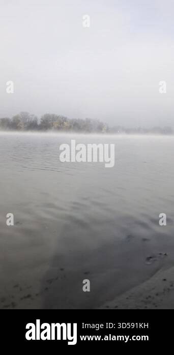 Misty autumn morning over calm river and distant trees Stock Video ...