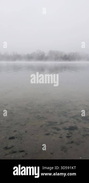 Misty autumn morning over calm river and distant trees Stock Video ...