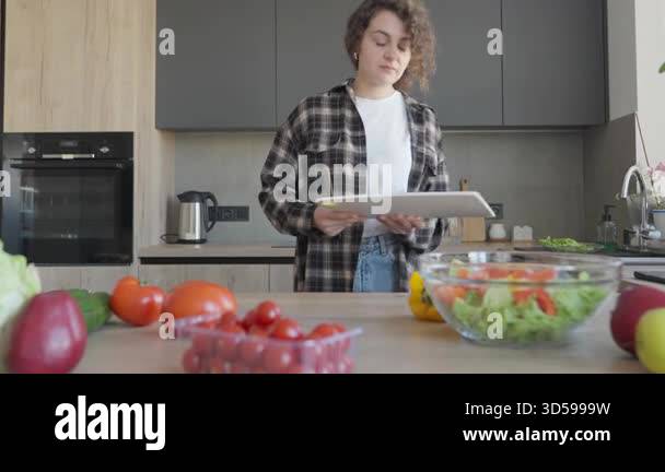 Woman Washing Cutting Board After Preparing Fresh Vegetables In Modern ...