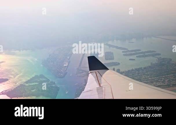 View from airplane window during takeoff above Miami with city and ...