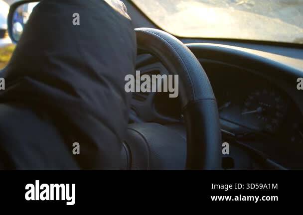 The driver drinks strong alcohol while driving. Drunk driving. The ...