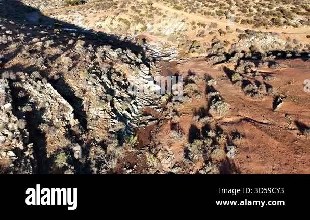 Aerial View of Dry Desert Foothills with Exposed Rock Strata and Dirt ...