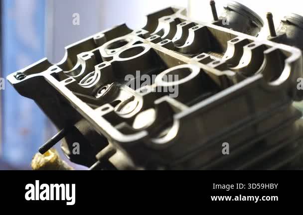 Close up of male hands repairing car engine. Man engaged servicing auto ...