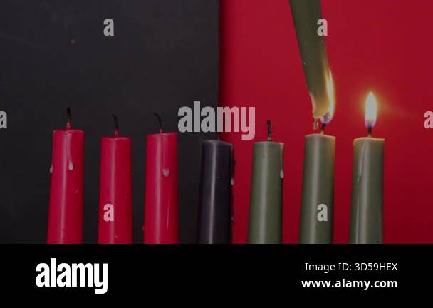 African American Kwanzaa holiday concept with traditional lit candles ...