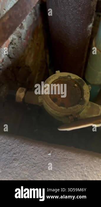 Plumber repairing a broken PVC water pipe with strong water leakage ...