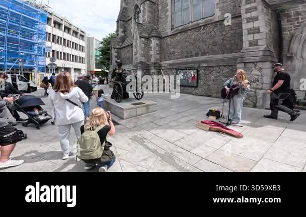 DUBLIN, IRELAND - JULY 16 2025: The iconic bronze statue of fictional ...