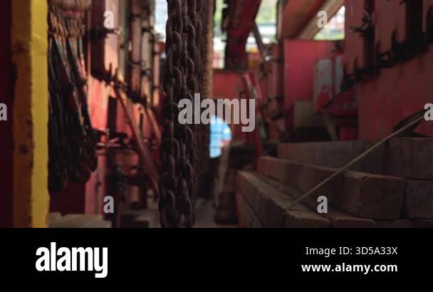Rusty chains bunch near construction materials on cargo ship vessel ...