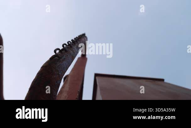 Weathered chain hangs on rusty metal railing low angle shot. Cargo ship ...