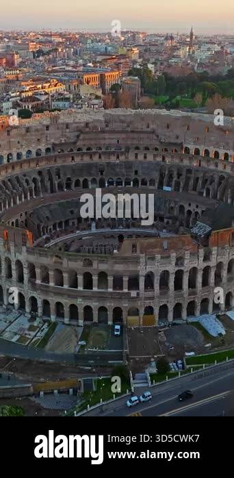 Aerial view of iconic ancient Arena of Colosseum at sunset. Flavian ...