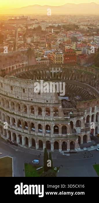 Aerial view of iconic ancient Arena of Colosseum at sunset. Flavian ...