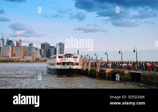 Jersey City, USA, 14 July 2025: Crowds boarding Statue Cruises ferry ...