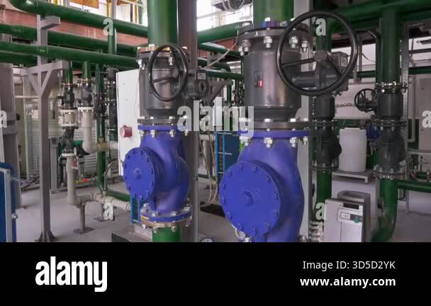 Mini-boiler room inside: pipes with valves and shut-off valves ...
