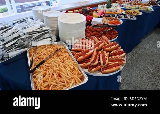 Buffet table with hot dogs, fries, and salads on cruise ship. Close-up ...