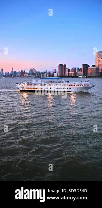 Cruise ship on the Hudson River at sunset in New York. White cruise ...