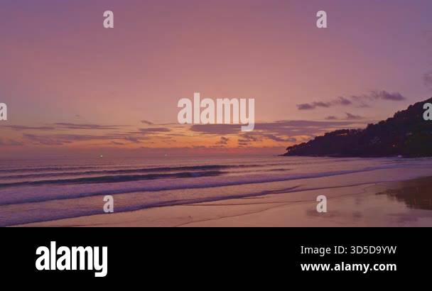 Calm ocean waves under purple sky Stock Video Footage - Alamy