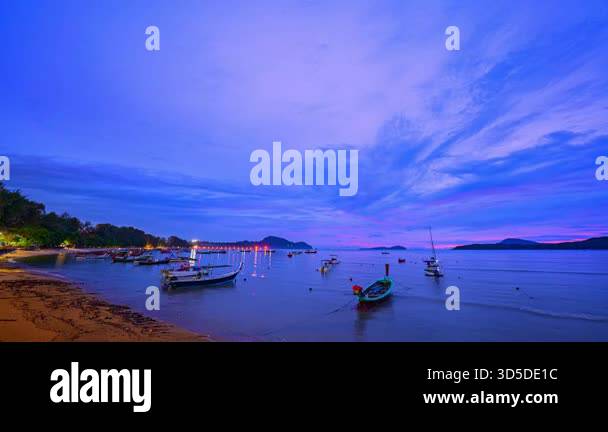 Boats floating on calm water at dusk Stock Video Footage - Alamy
