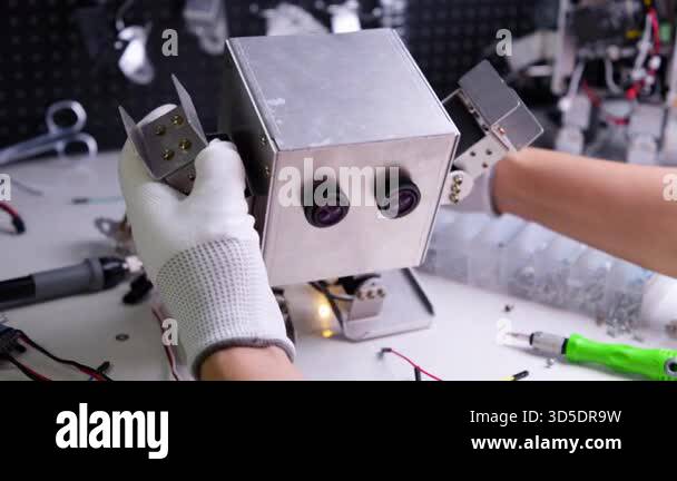 Repair the robot on the workbench Stock Video Footage - Alamy