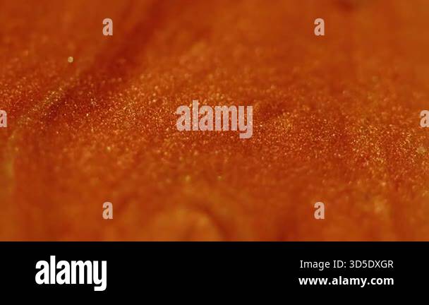 Shimmer drip. Glitter background. Defocused orange golden color paint ...