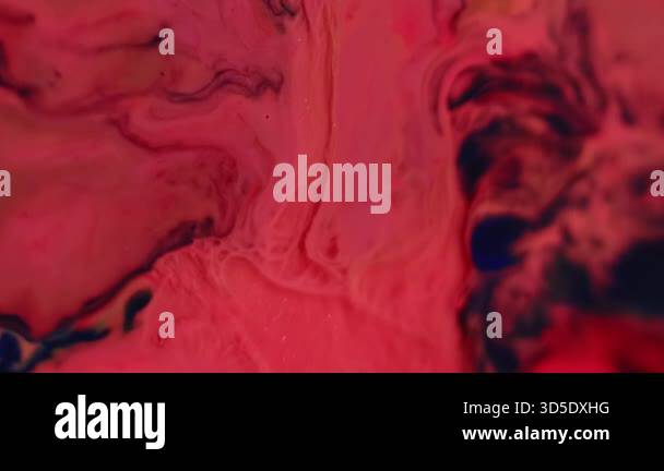 Ripple stains. Liquid background. Defocused orange pink color acrylic ...