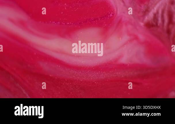 Shiny flowing liquid. Abstract ink. Defocused red crimson purple ...