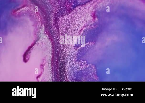 Shiny flowing liquid. Abstract ink. Defocused purple blue colorful ...