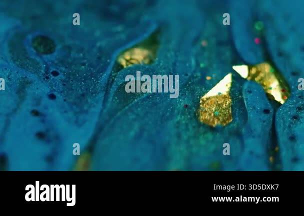 Shimmer fluid. Sparkling texture. Blur blue red green color paint ...