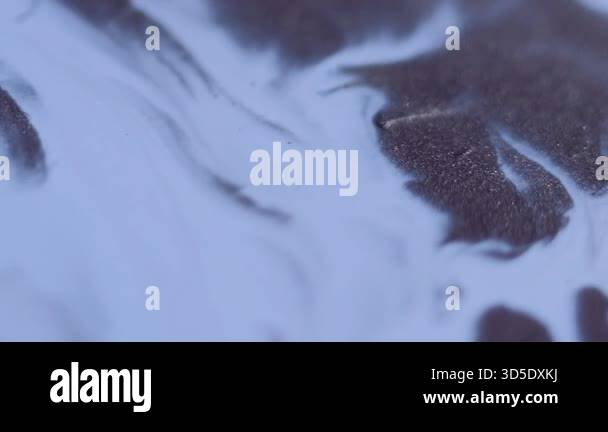 Enamel drip. Abstract paint. Defocused metallic blue black color ripple ...