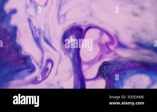 Shiny paint pigment. Ink particles. Defocused purple blue colorful ...