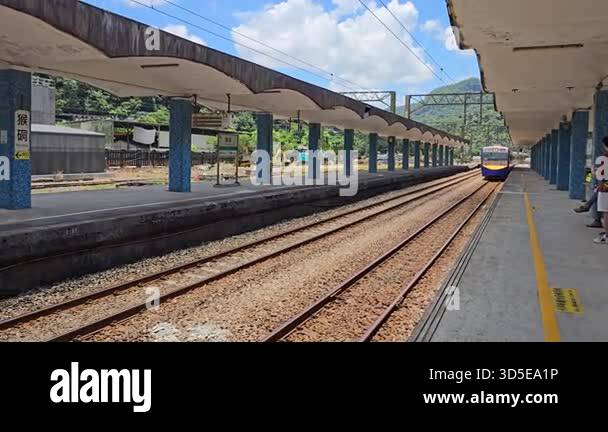 Taiwan Countryside Train Station with Train Arriving. A scenic ...