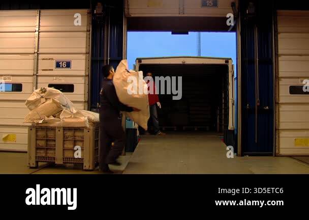 Workers loading cargo bags Stock Videos & Footage - HD and 4K Video ...